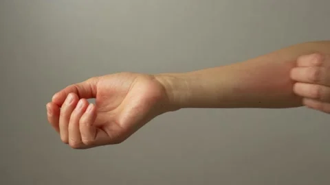 Woman scratching her hand over grey back... | Stock Video | Pond5