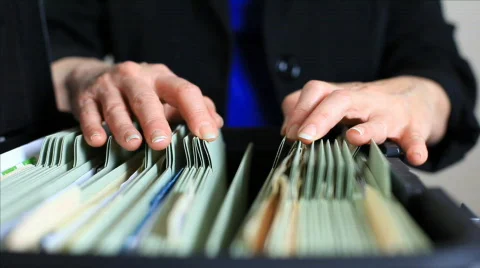 woman searching through files | Stock Video | Pond5