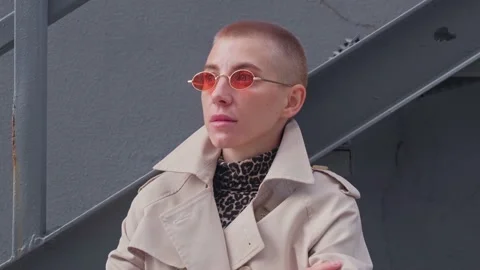 Woman with short hair in a leopard turtl... | Stock Video | Pond5