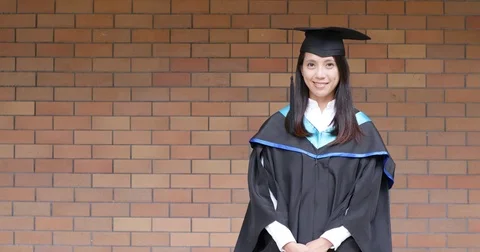 Woman showing point over red brick wall ... | Stock Video | Pond5