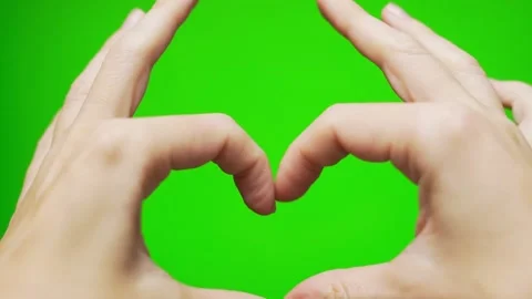 A Woman Shows Her Fingers a Heart Symbol... | Stock Video | Pond5