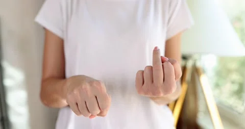 A woman shows the middle finger, slow mo... | Stock Video | Pond5