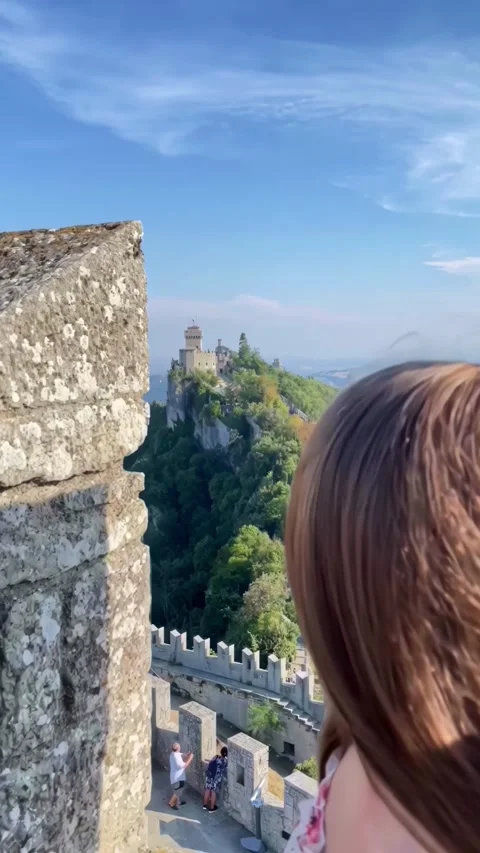 Woman Sitting on Castle Wall in San Mari... | Stock Video | Pond5