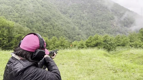 Woman Skeet Shooting with a Shotgun in a... | Stock Video | Pond5