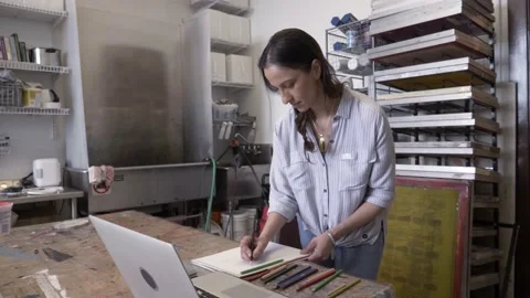 Woman sketching in craft workshop | Stock Video | Pond5