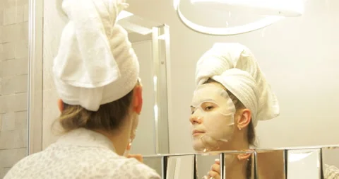 Woman smooth sheet mask for face with ma... | Stock Video | Pond5