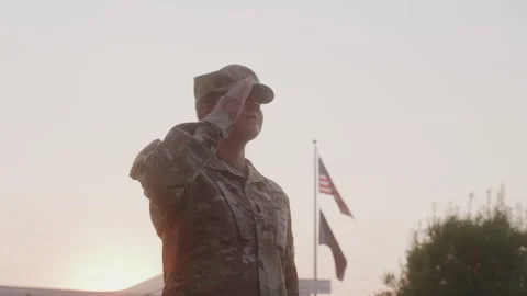 Woman Soldier Stands Saluting Flag | Stock Video | Pond5