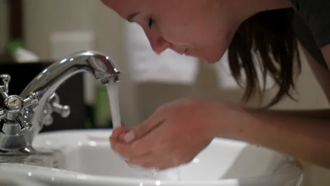 Woman splash tap water on face, morning ... | Stock Video | Pond5
