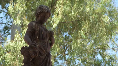 Woman statue classic figure in a garden | Stock Video | Pond5