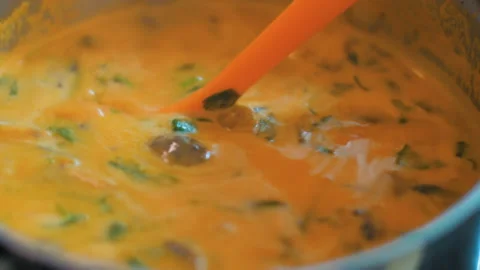 Woman stirs tasty and spicy Asian Tom Ya... | Stock Video | Pond5