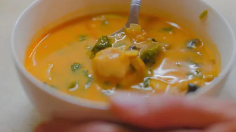 Woman stirs tasty and spicy Asian Tom Ya... | Stock Video | Pond5