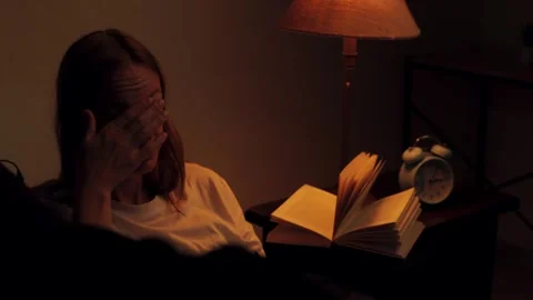 Woman Struggling to Stay Awake in Bed at... | Stock Video | Pond5