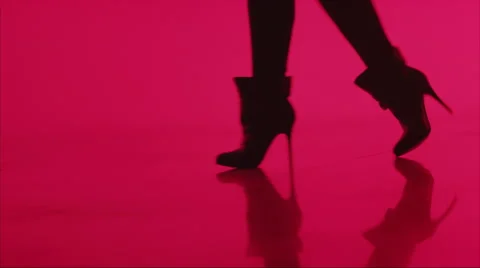 Woman struts in high heels in silhouette... | Stock Video | Pond5