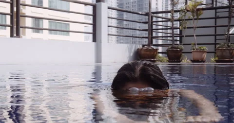 Woman Submerging And Smiles Upon Emergin... | Stock Video | Pond5