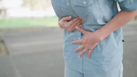 Woman suffering from gastric spasms Abdo... | Stock Video | Pond5