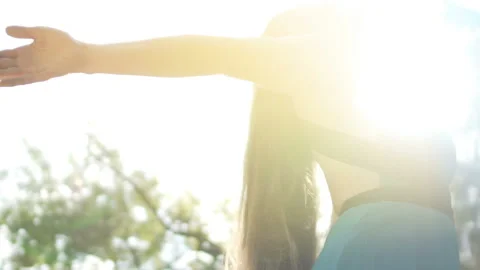 Woman in sun rays feels freedom, young f... | Stock Video | Pond5