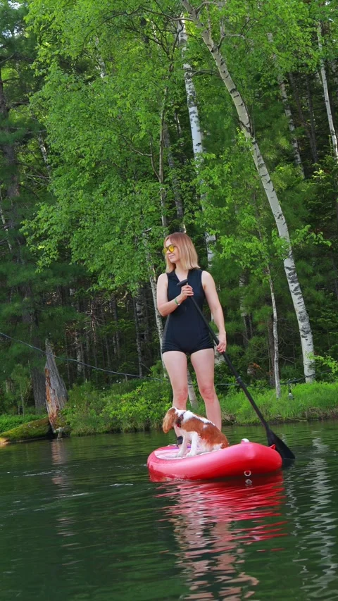 woman supping on a beautiful lake in the... | Stock Video | Pond5