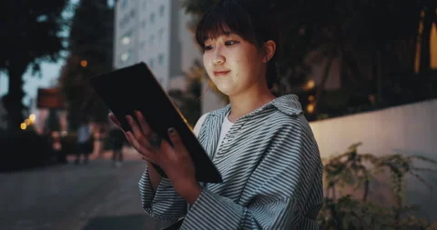 Woman, tablet and scroll at night in str... | Stock Video | Pond5