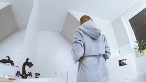 Woman Takes Off Her Bathrobe Stock Footage ~ Royalty Free Stock Videos ...
