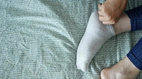 Woman Takes Off Socks Stock Videos – Royalty-Free HD & 4K Videos