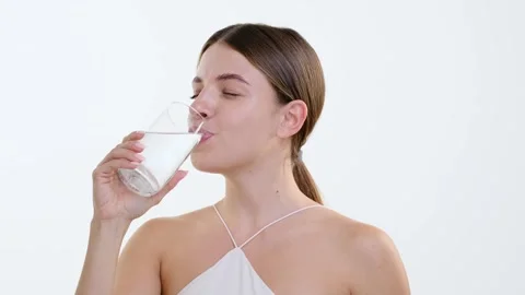 Woman Taking a Sip from a Glass of Water... | Stock Video | Pond5