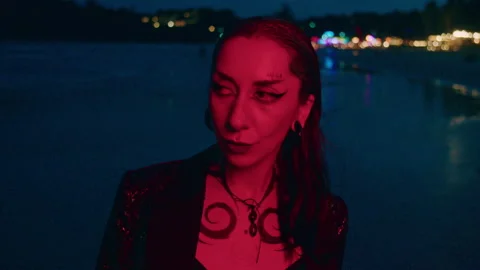 a woman with a tattoo on her face is sta... | Stock Video | Pond5