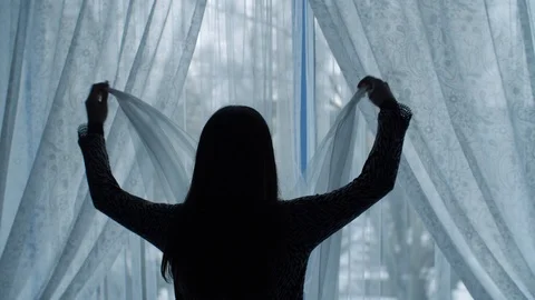 Woman throw out curtains and open window | Stock Video | Pond5