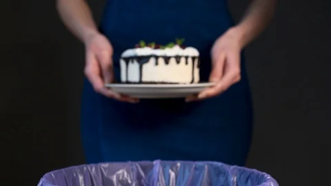 Woman throwing birthday cake in trash ca... | Stock Video | Pond5