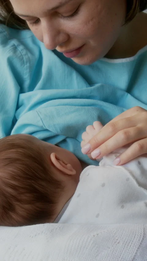 Woman Touching Hand of Her Baby While Br... | Stock Video | Pond5