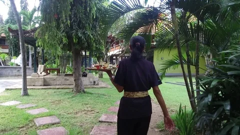 Woman with a tray is walking in the reso... | Stock Video | Pond5