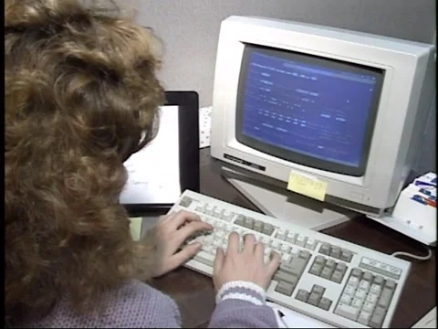 Woman typing on 1980's or early 1990's D... | Stock Video | Pond5