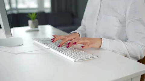 Woman typing on a computer keyboard. Con... | Stock Video | Pond5