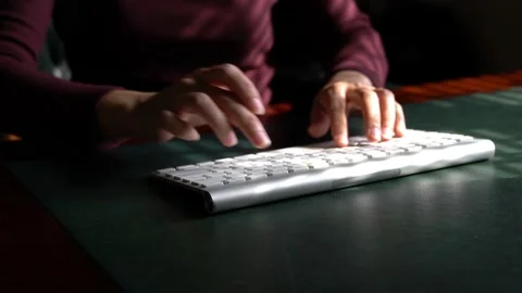 Woman typing on her computer keyboard at... | Stock Video | Pond5