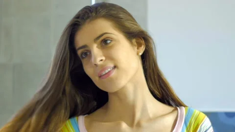 Woman undoing from bun long hair slow mo... | Stock Video | Pond5