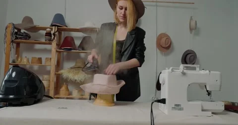 Woman uses iron to steam felt body pulle... | Stock Video | Pond5