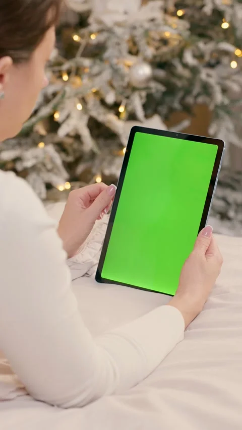 Woman Uses Tablet With Green Screen Lyin... | Stock Video | Pond5