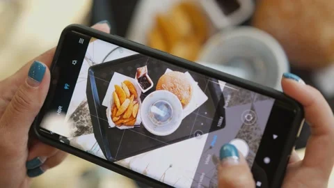 Woman using phone to take pictures of Bu... | Stock Video | Pond5