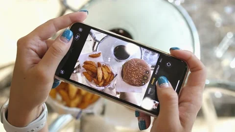 Woman using phone to take pictures of Bu... | Stock Video | Pond5