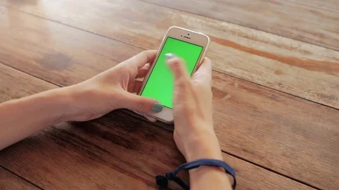 woman using smart phone with green scree... | Stock Video | Pond5