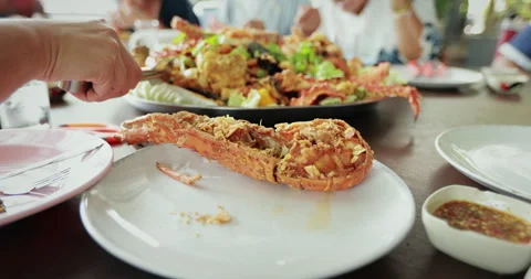 Woman using tongs grab cooked alaskan cr... | Stock Video | Pond5