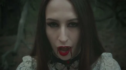woman vampire, beautiful red lips drippi... | Stock Video | Pond5
