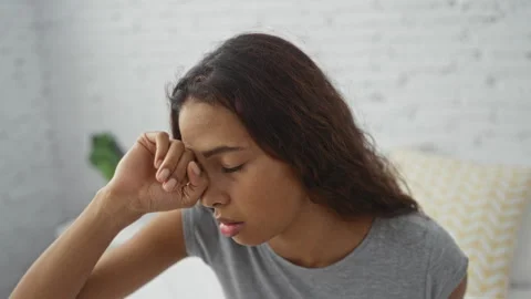 Woman waking up in bed looking groggy an... | Stock Video | Pond5