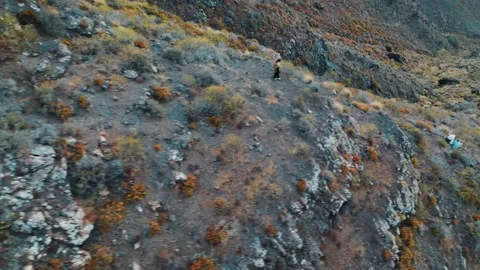 A Woman Walking Down The Steep Slope Of ... | Stock Video | Pond5