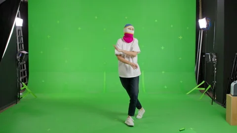 Woman walking on a Green Screen | Stock Video | Pond5