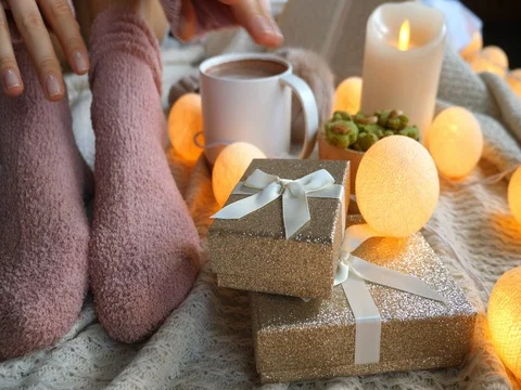 Woman In Warm Socks And Sweater Taking G... | Stock Video | Pond5