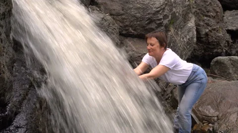 Woman Washes Her Waterfall of Fun Laughs... | Stock Video | Pond5