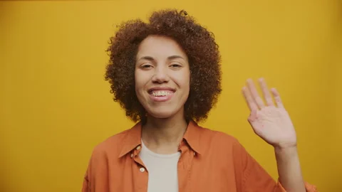 Woman Waving Arm in Greeting Gesture on ... | Stock Video | Pond5