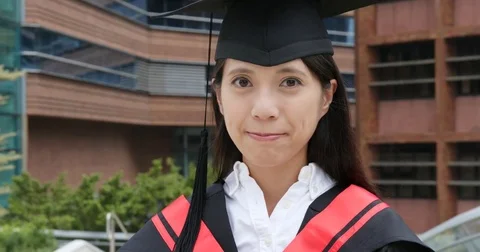 Woman wear graduation gown in university... | Stock Video | Pond5