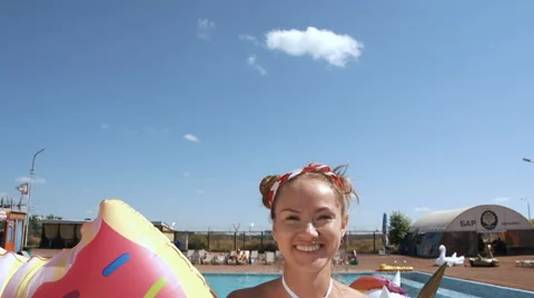 Woman in white bikini jumping into swimm... | Stock Video | Pond5