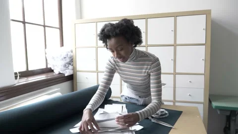 Woman working in fabric design studio | Stock Video | Pond5